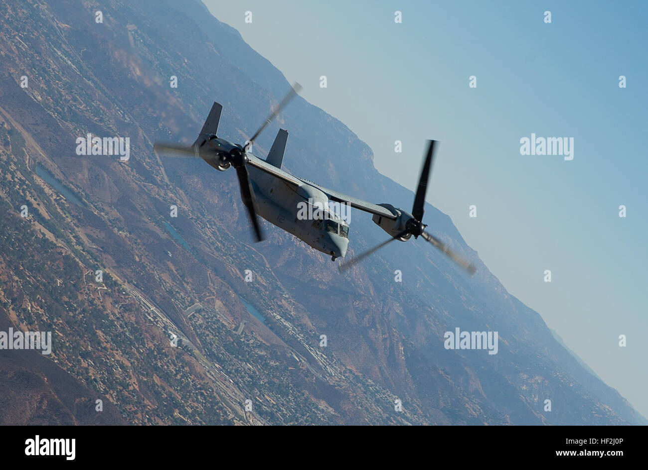 An MV-22B Osprey tiltrotor aircraft demonstrates flight capabilities at ...