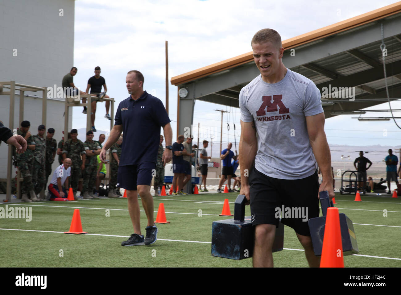 Lance Cpl. Andrew Ashley preforms a farmer’s carry with weighted boxes ...