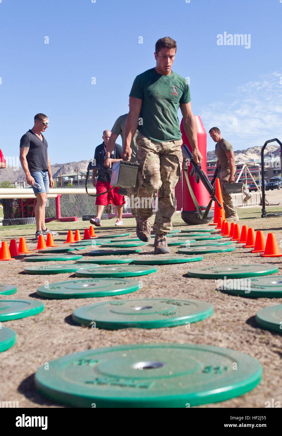 A British Royal Marine maneuvers through a simulated minefield during ...