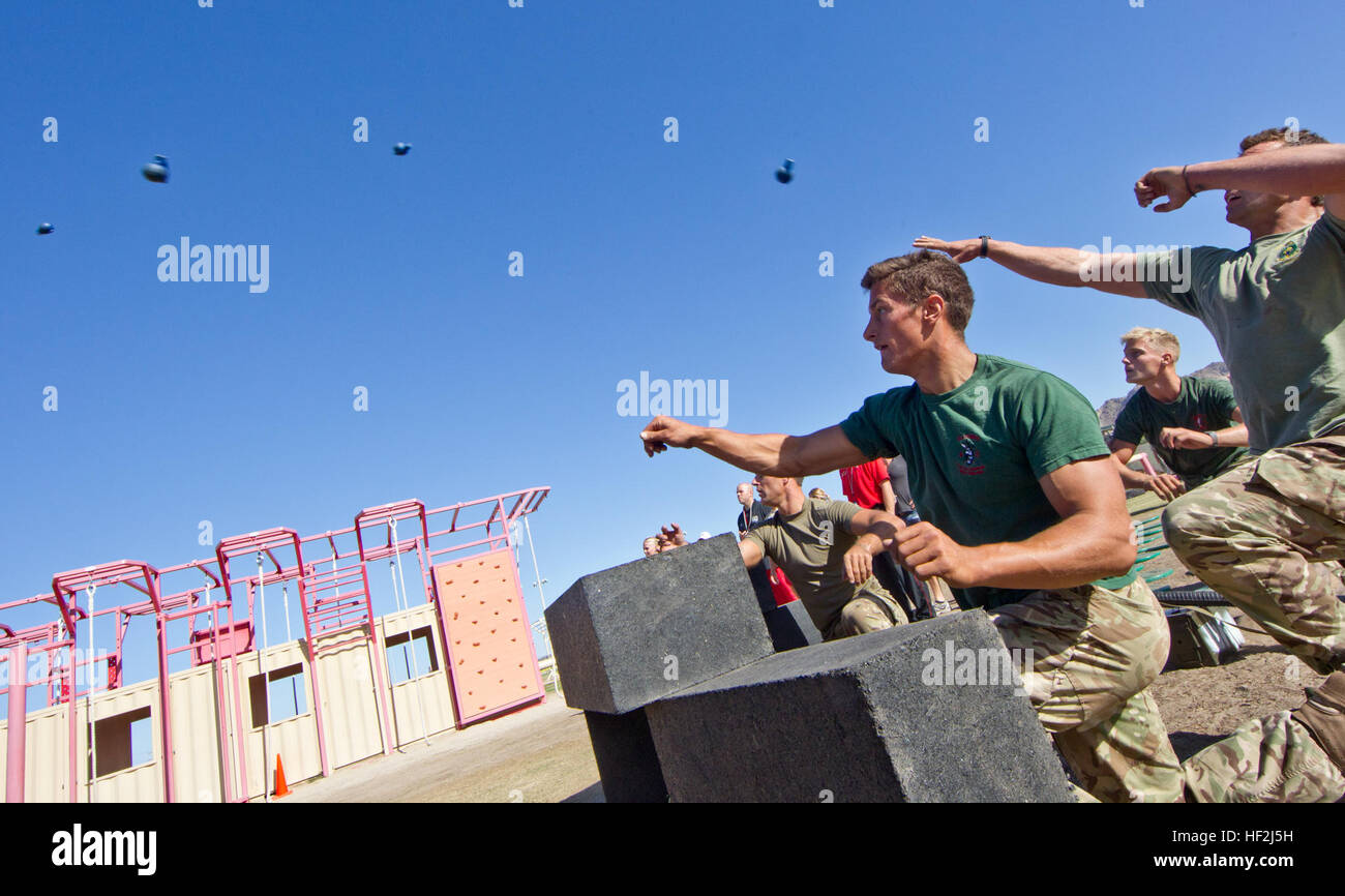 Members of the British Royal Marines toss simulated grenades during an ...