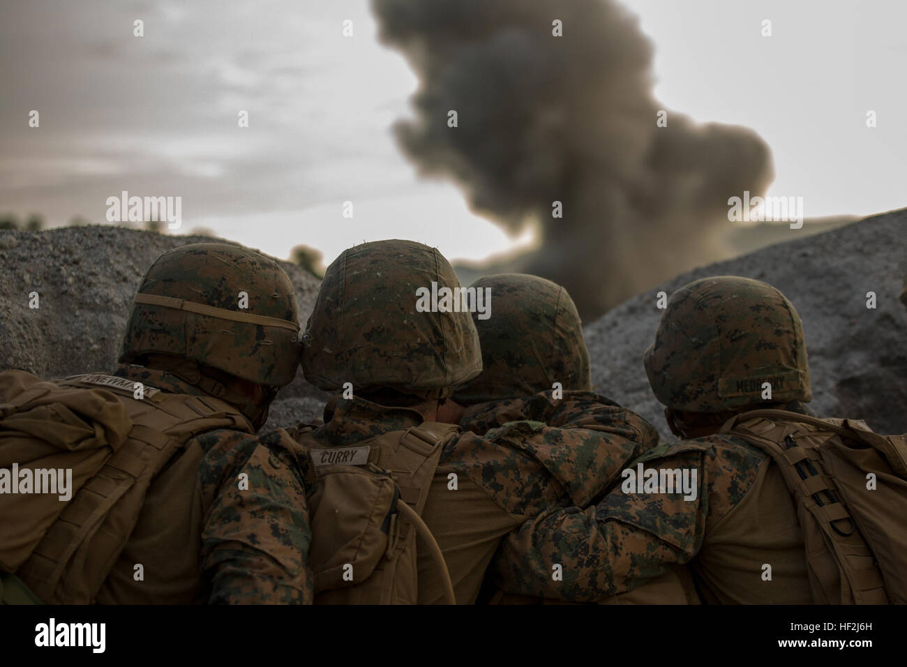 U.S. Marines observe explosives detonate from a safe distance on a ...