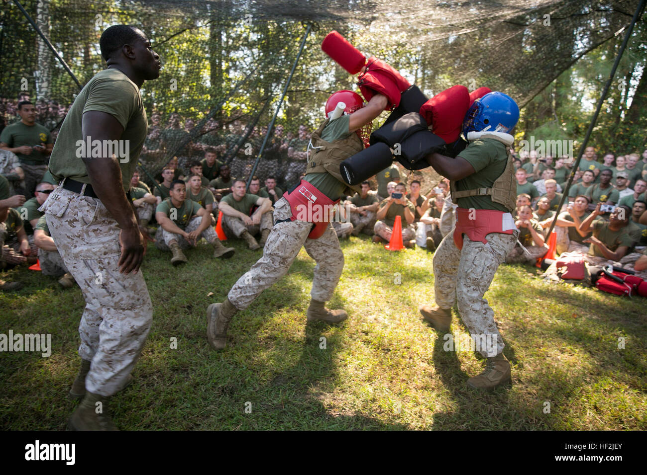 Cpl. Cameron Castillo, center, a satellite communications operator with ...