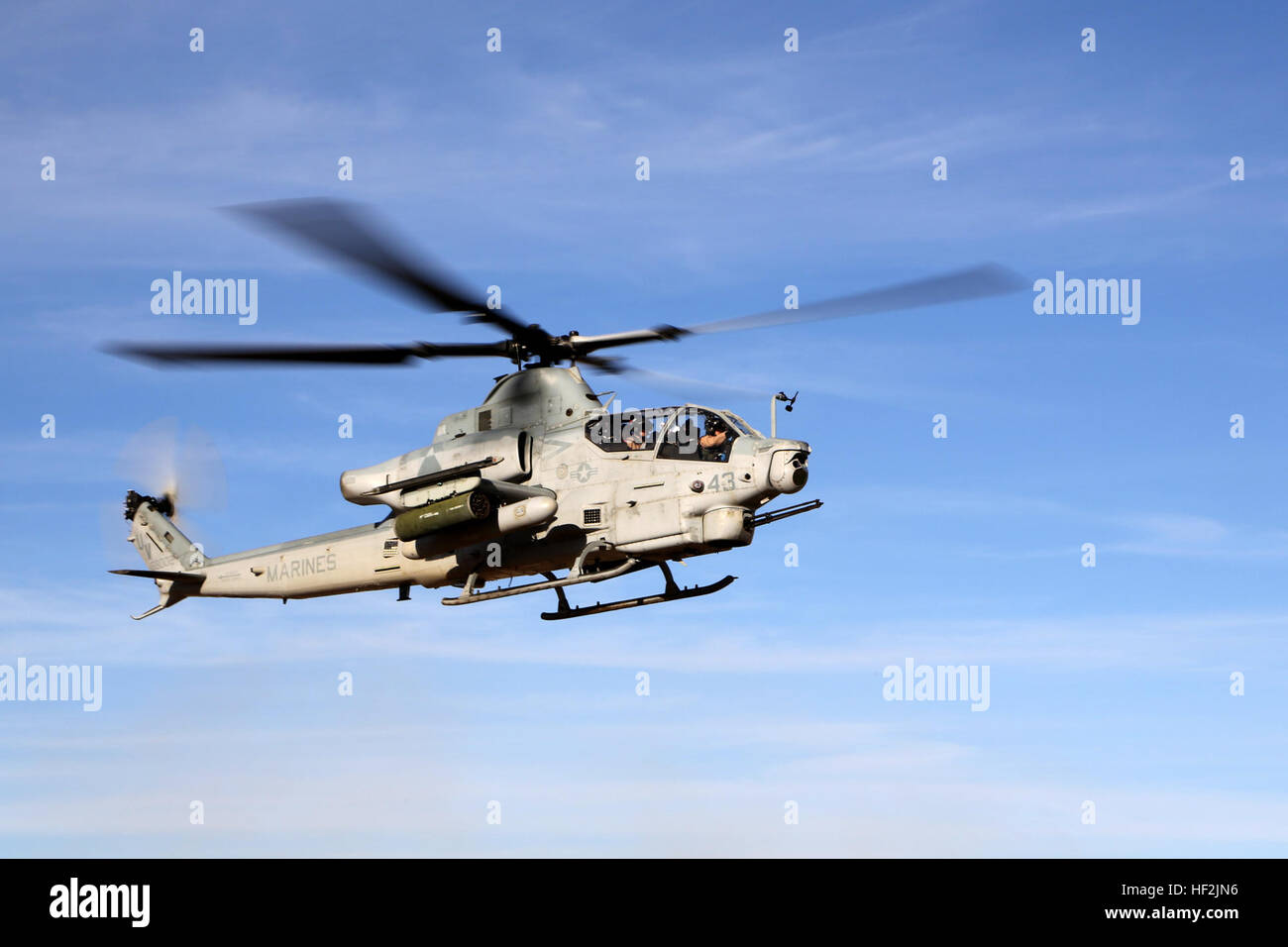 A U.S. Marine Corps AH-1Z Cobra helicopter takes off from a refueling ...