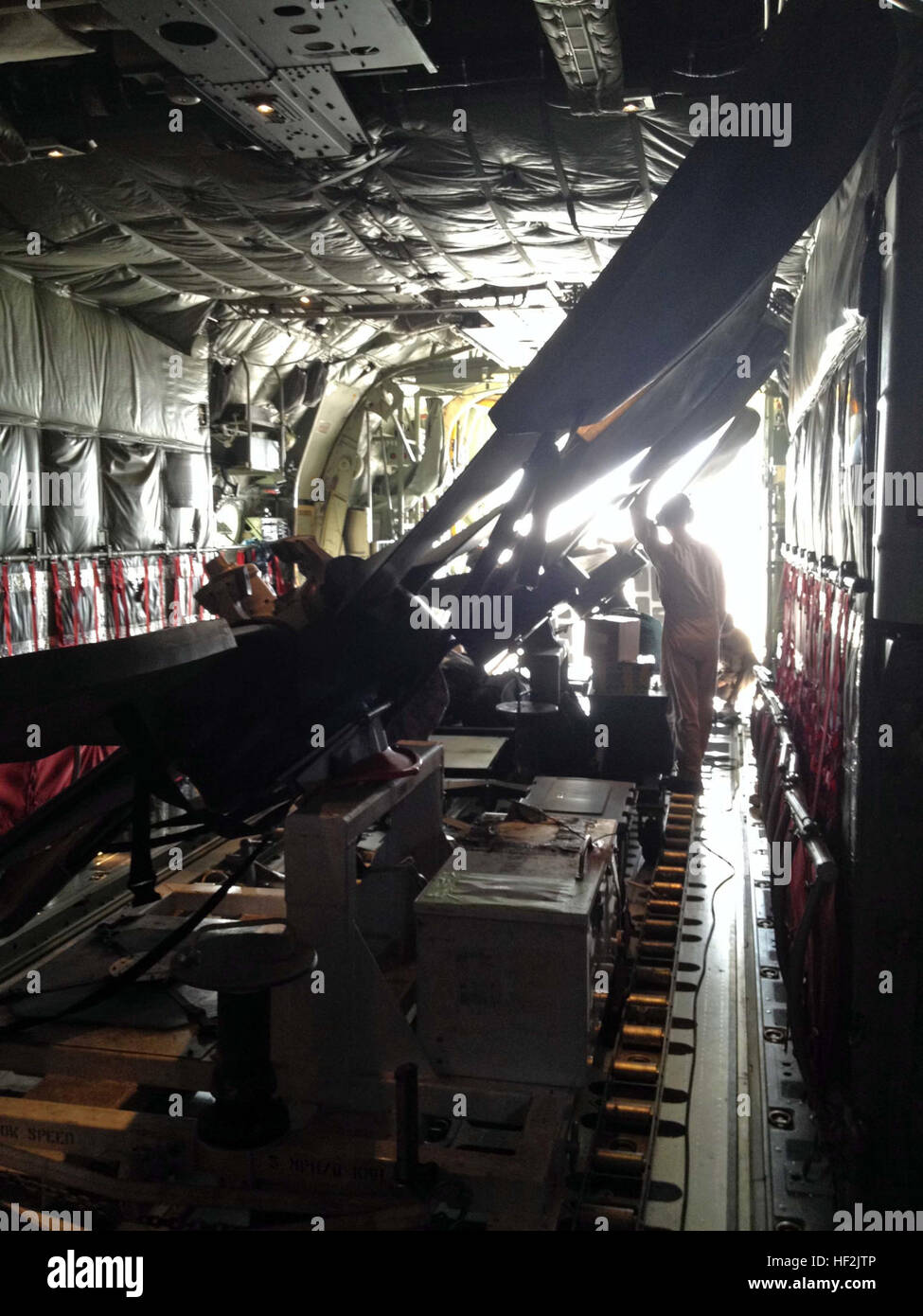 Three propellers are loaded into the cargo compartment of a KC-130J ...