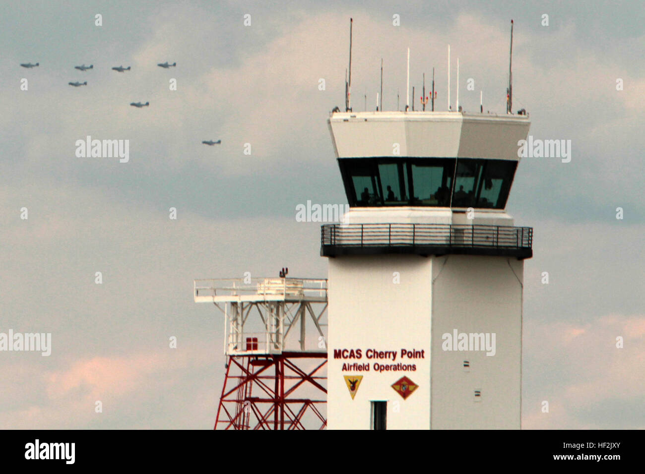 The air traffic control tower sits in the foreground as seven EA-6B ...