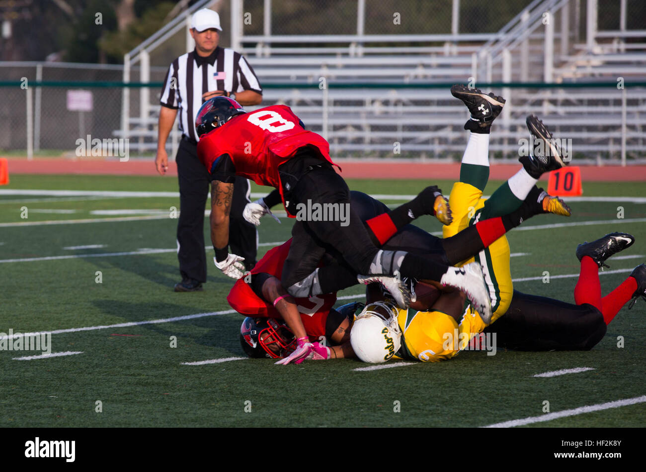 A cast of Marine Corps Air Station Miramar Falcons tackles the 3rd ...