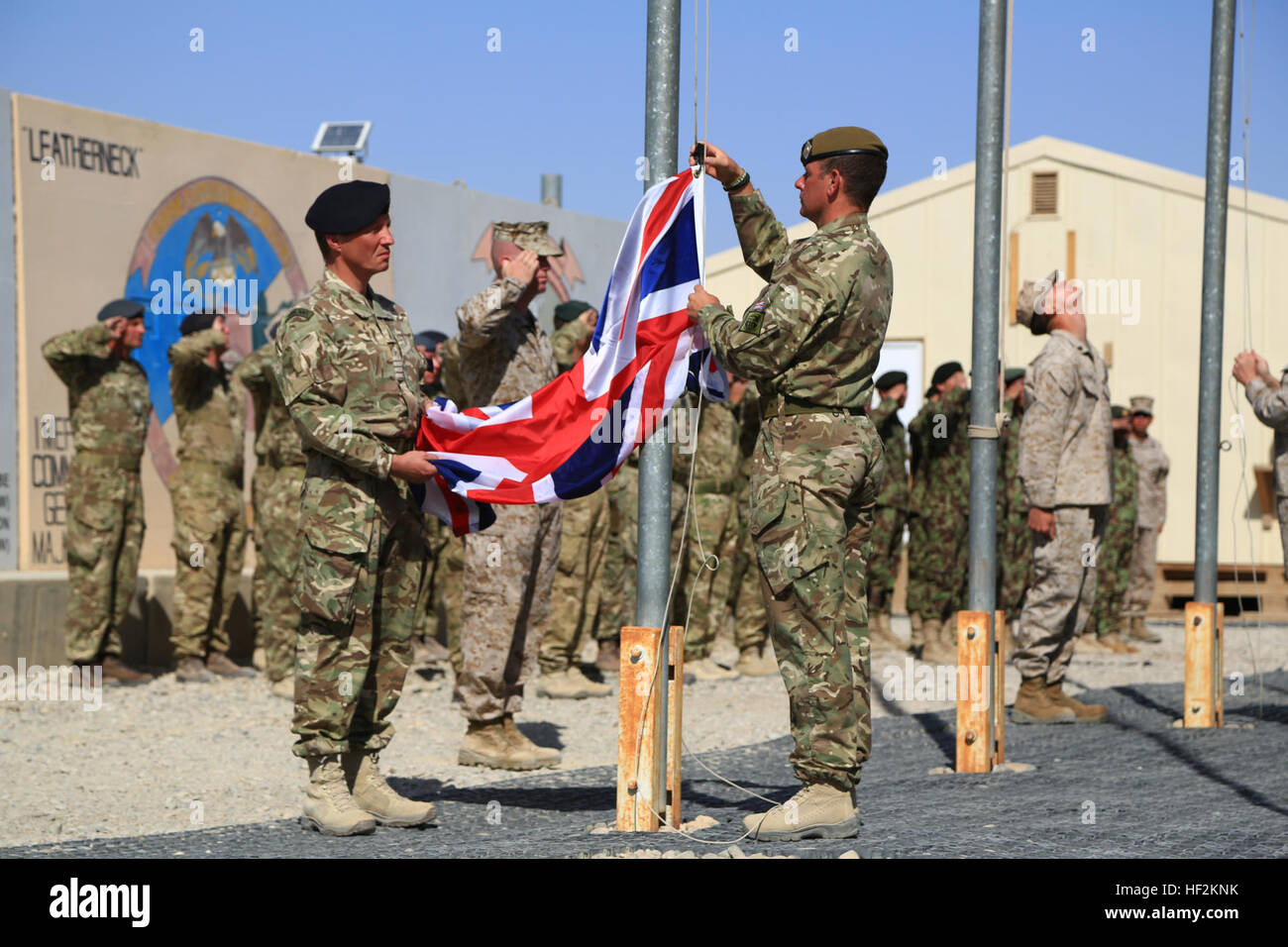 United Kingdom (UK) soldiers lower the UK flag during the Regional ...
