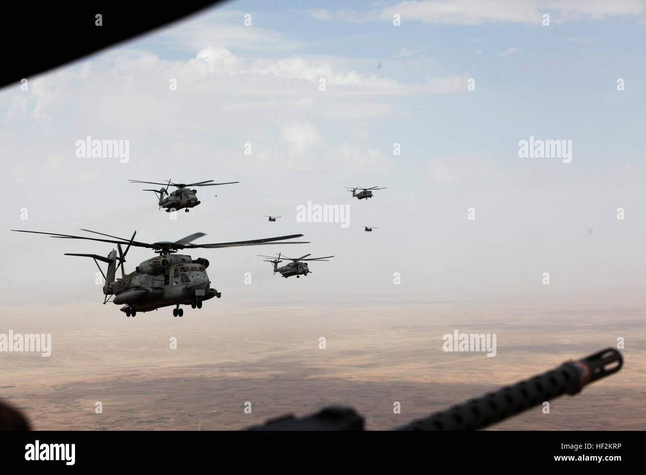 Marine Corps and Royal Air Force helicopters fly in formation after ...