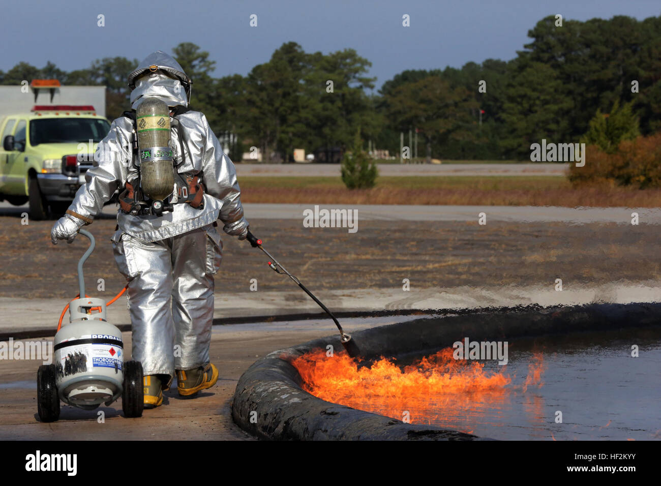 Aircraft rescue firefighter conducts hi-res stock photography and ...