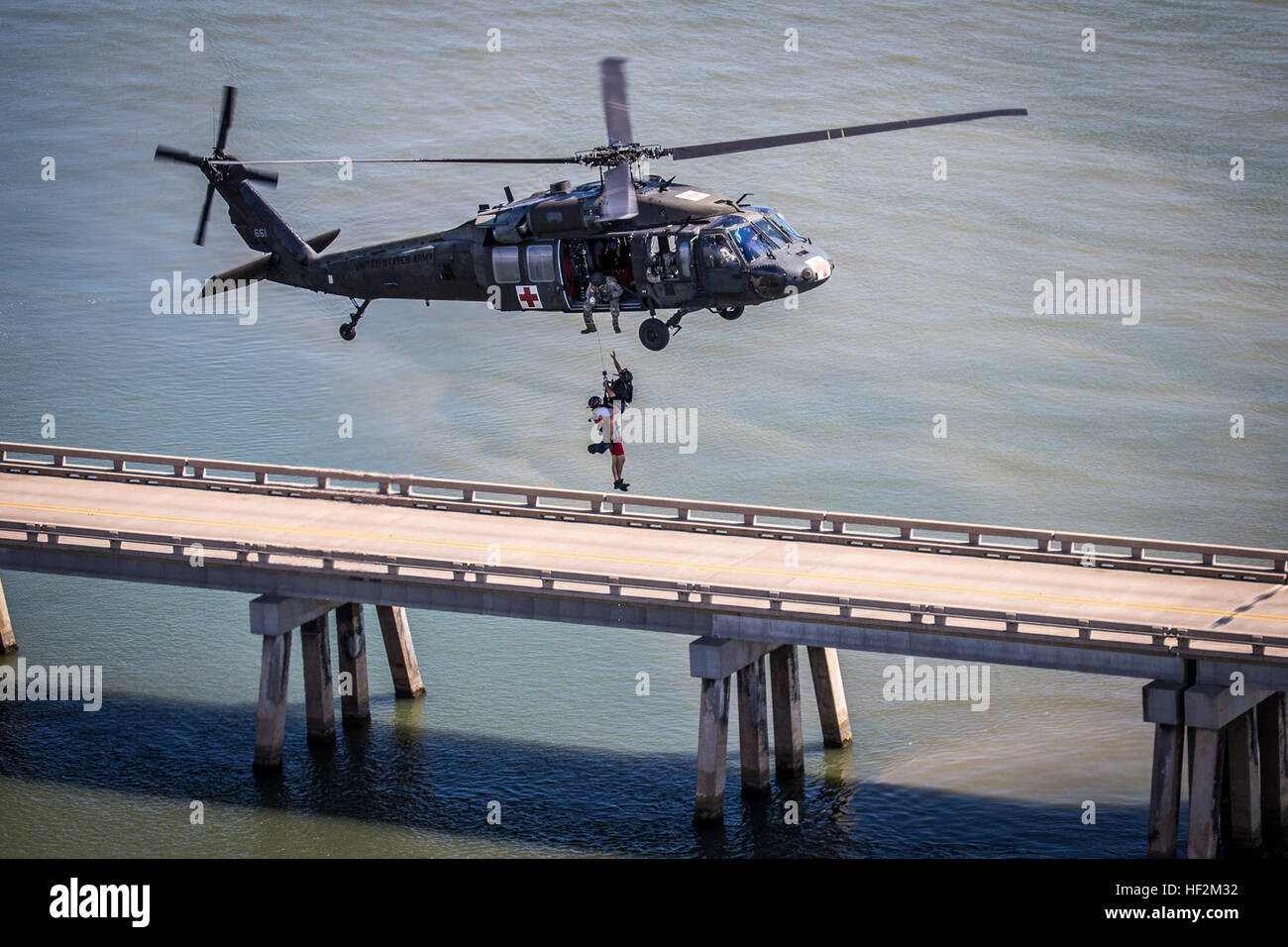 Soldiers hoist members of Texas Task Force 1 (TX-TF1) into their UH-60 ...