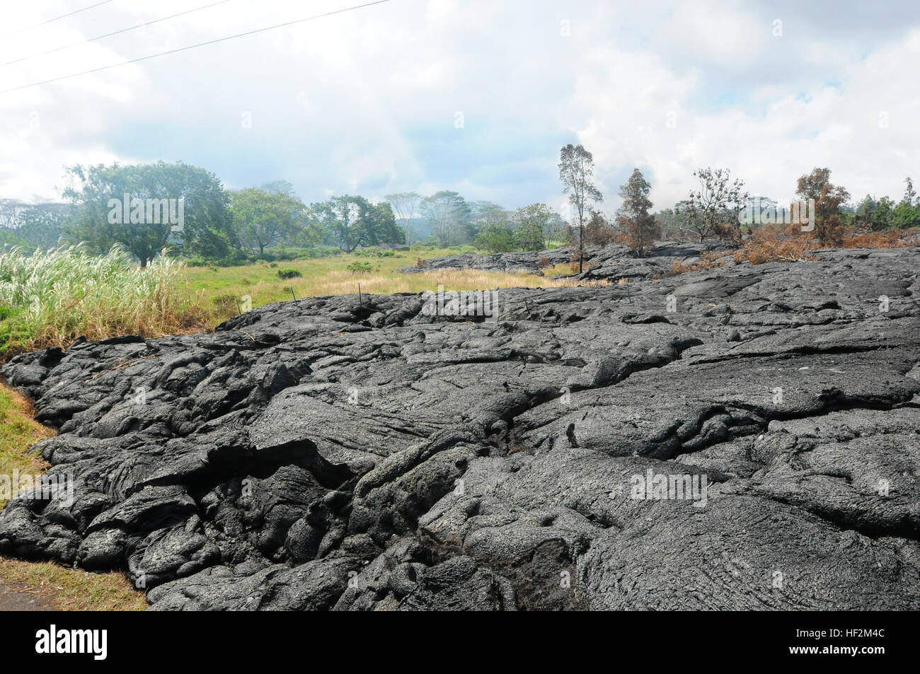 Even as the uppermost layers of the lava flow cools, the bottom layer ...