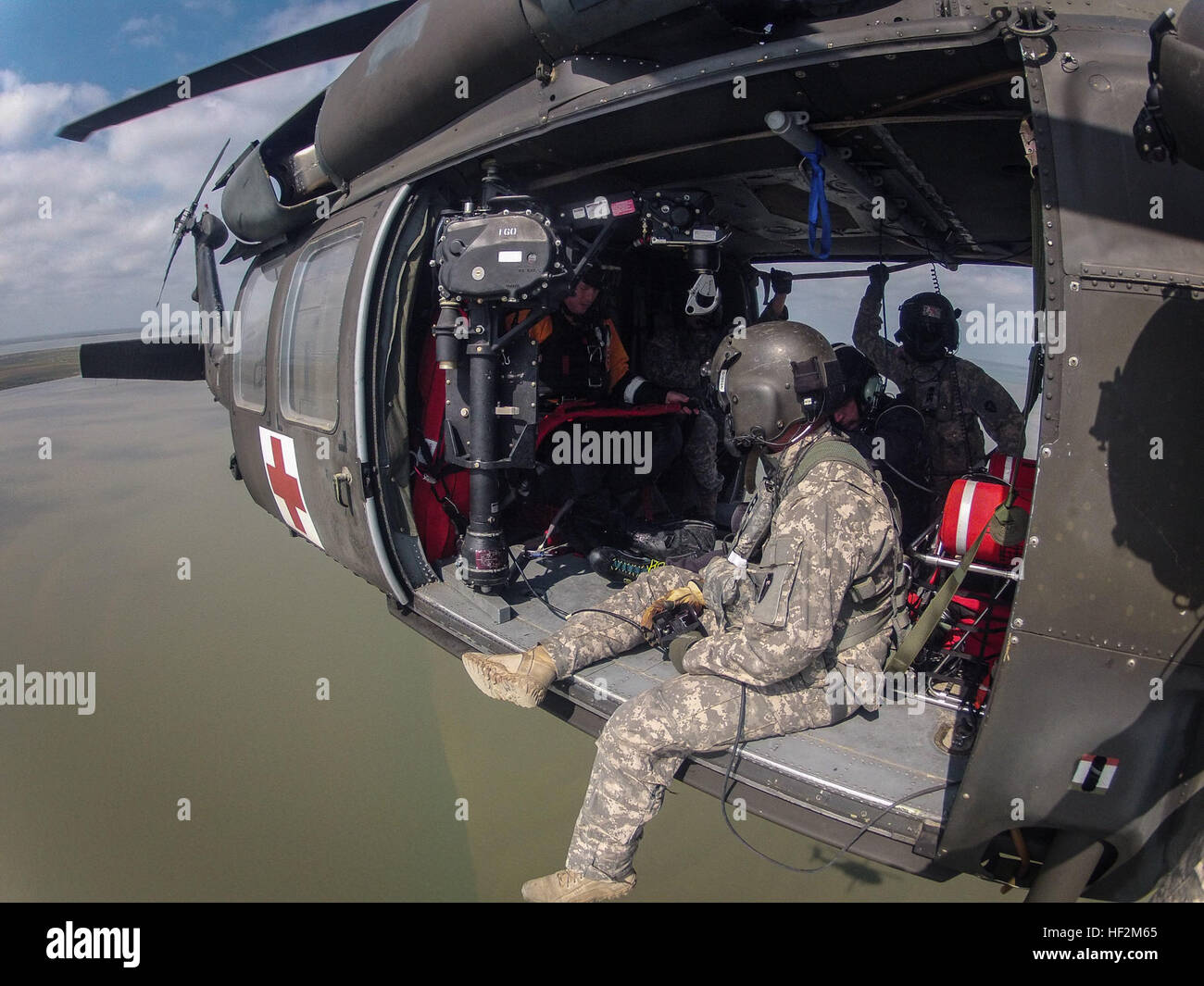 Army Spc. David Sobieski takes a break during overwater helicopter ...