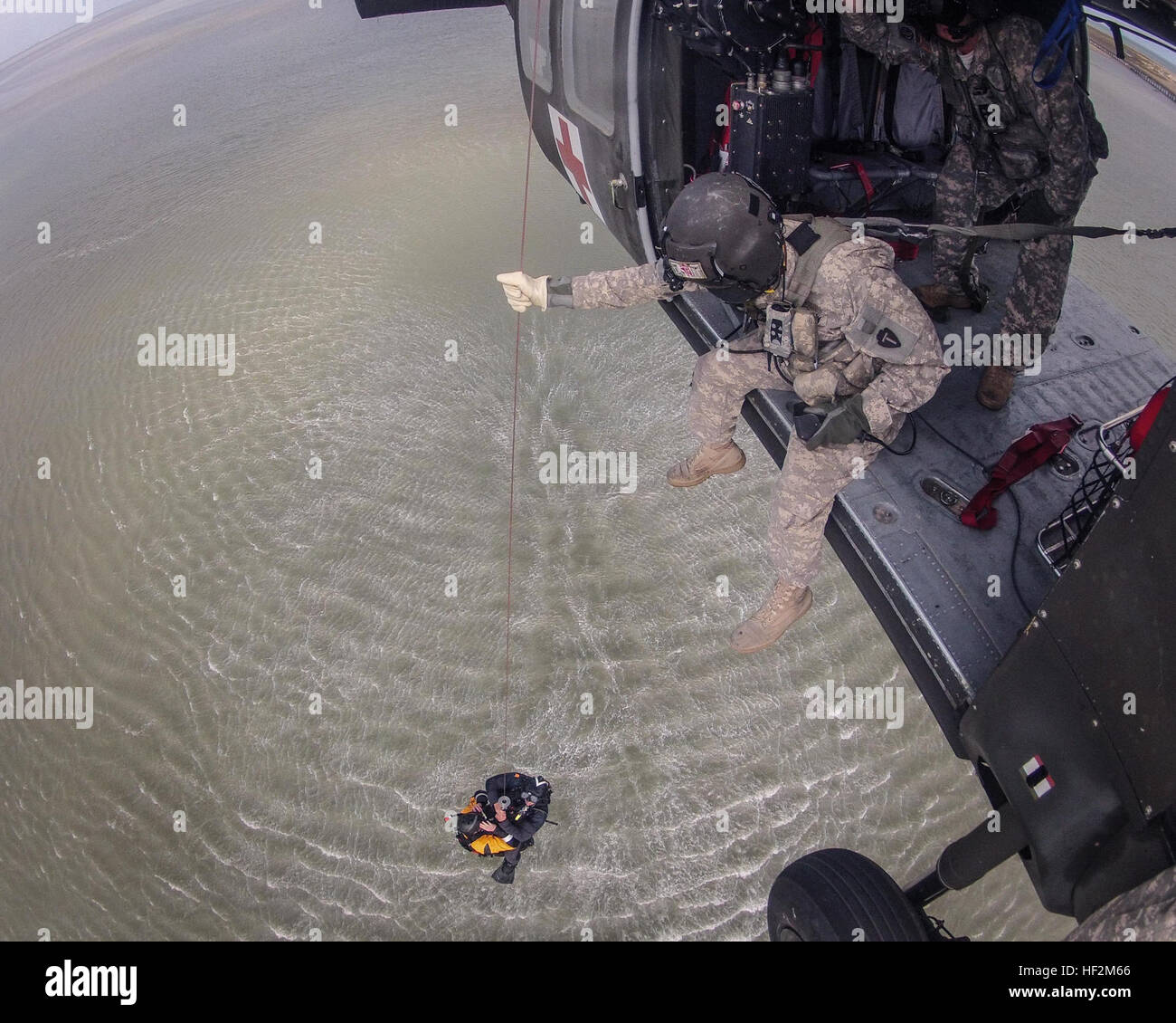 Sgt. A.J. Harrelson (sitting) and Sgt. Chris Renaud hoist Lynn ...