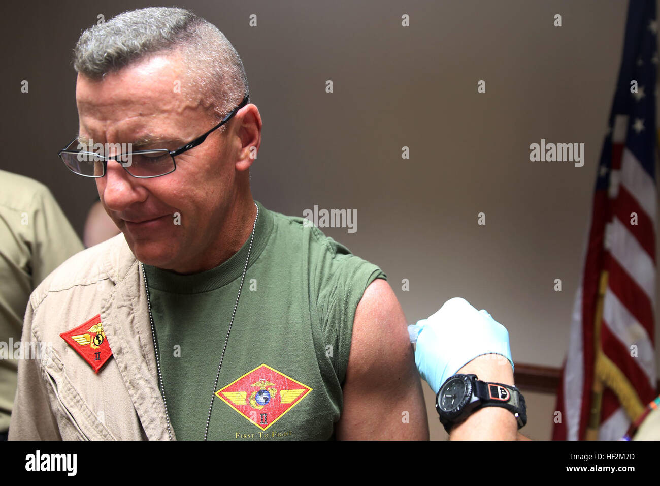 Maj. Gen. Robert F. Hedelund receives his his annual flu shot at the ...