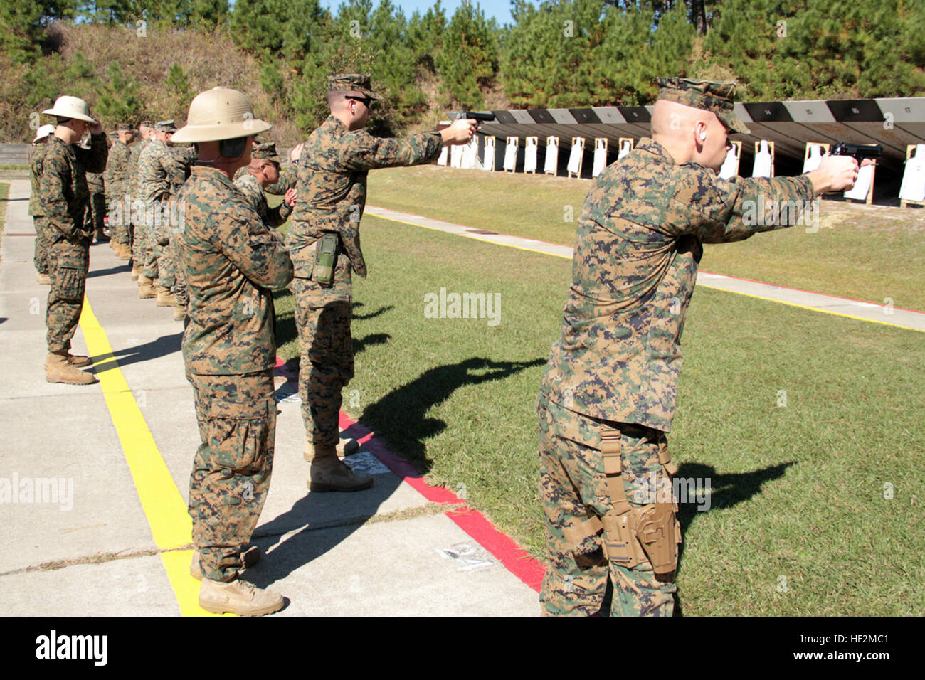 Marines fire down range with the M9 9mm pistol during Combat Pistol ...