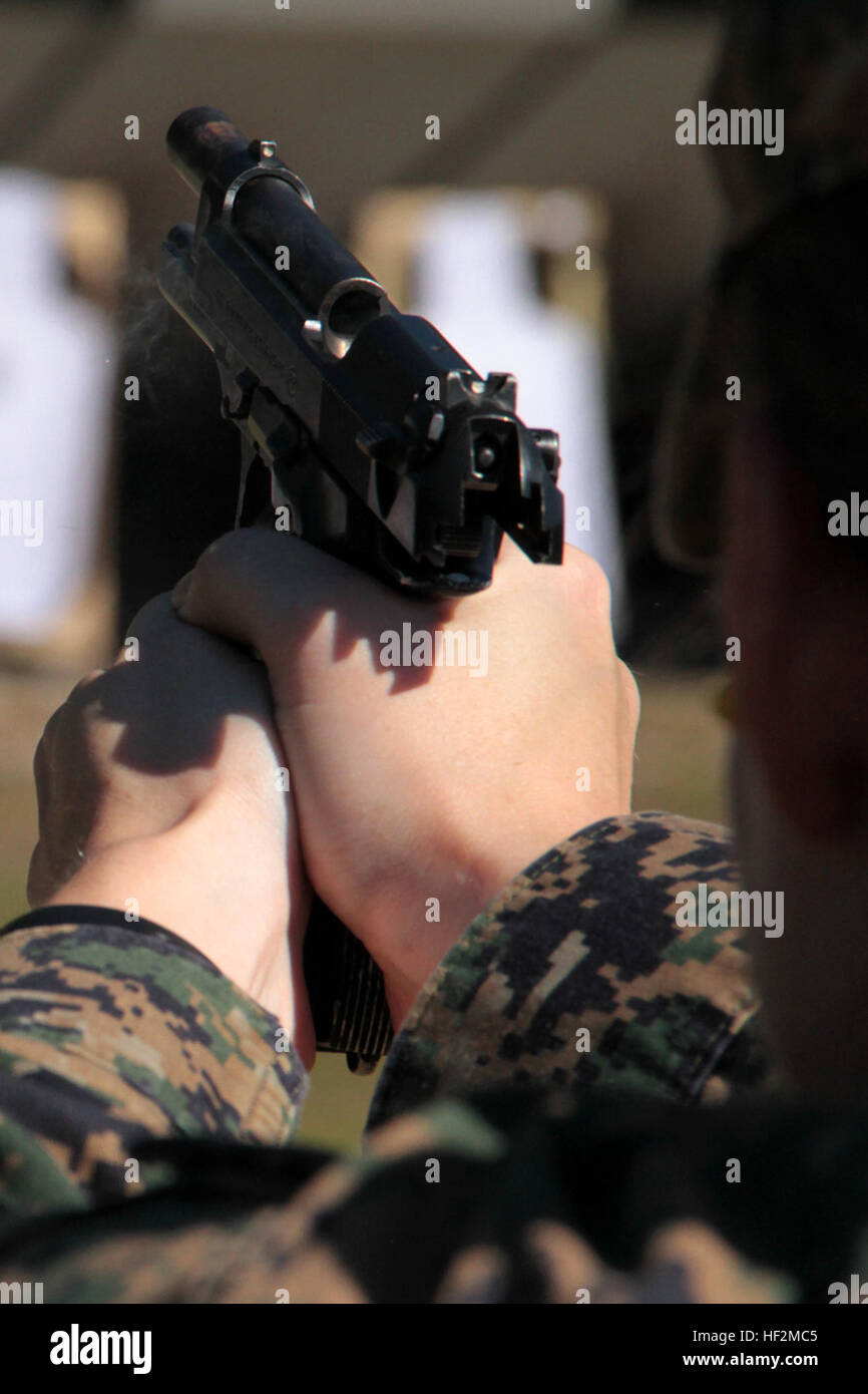 A Marine fires an M-9 9mm pistol during training at the Marine Corps ...