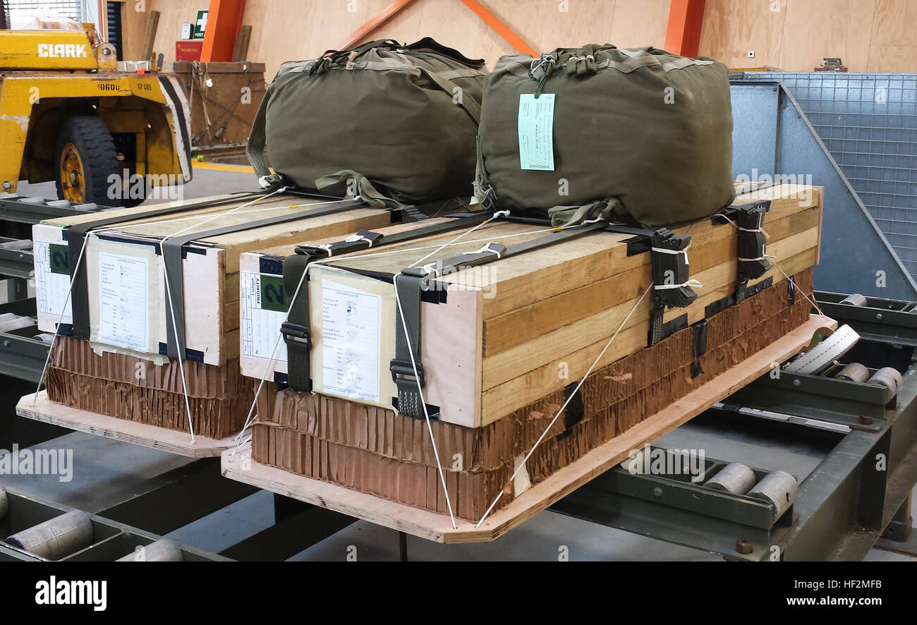 Pallets of lumber wait to be prepared for air drop by U.S. Marines with ...