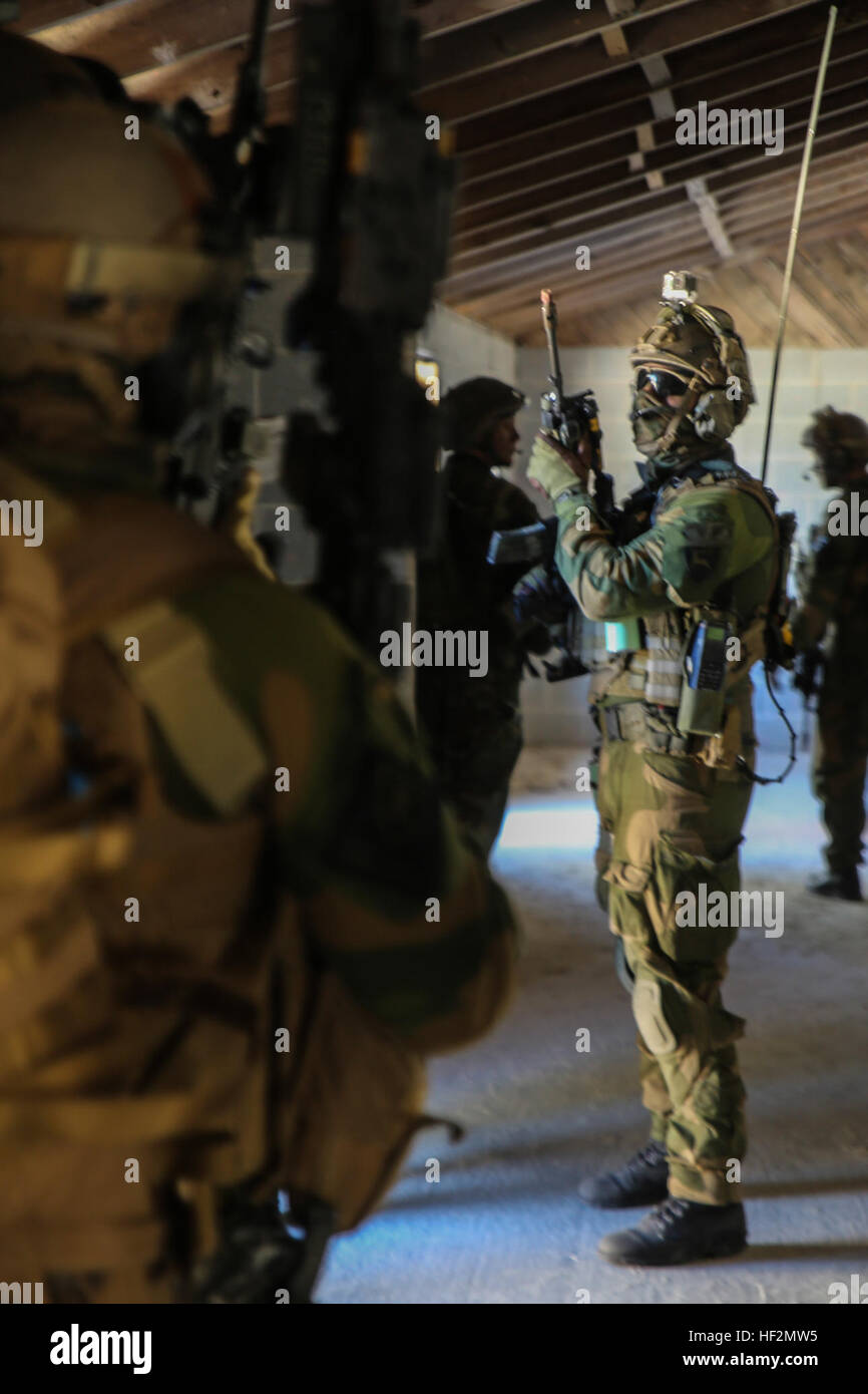 Soldiers with the Norwegian Telemark Battalion prepare to advance on an ...