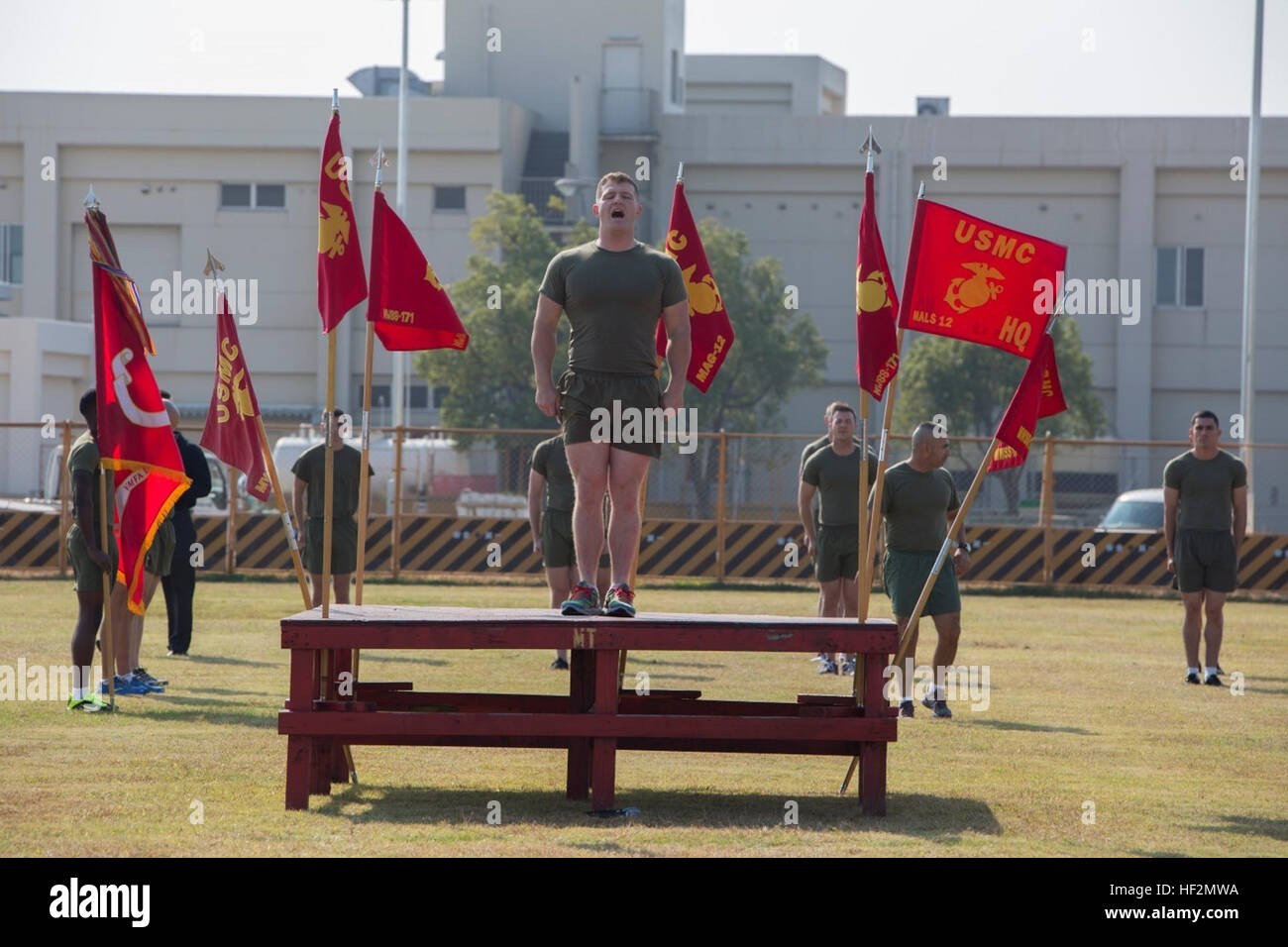 Service members with Marine Aircraft Group 12 warm up before running ...
