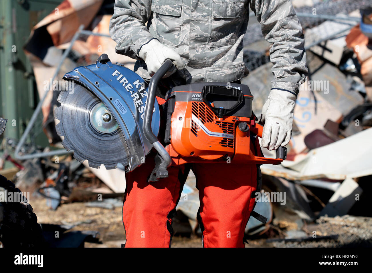 U.S. Air Force Senior Airman Matthew Wagner holds a rescue saw at ...