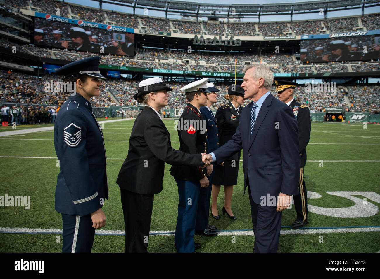 Secretary of the Navy Ray Mabus shakes hands with service members ...