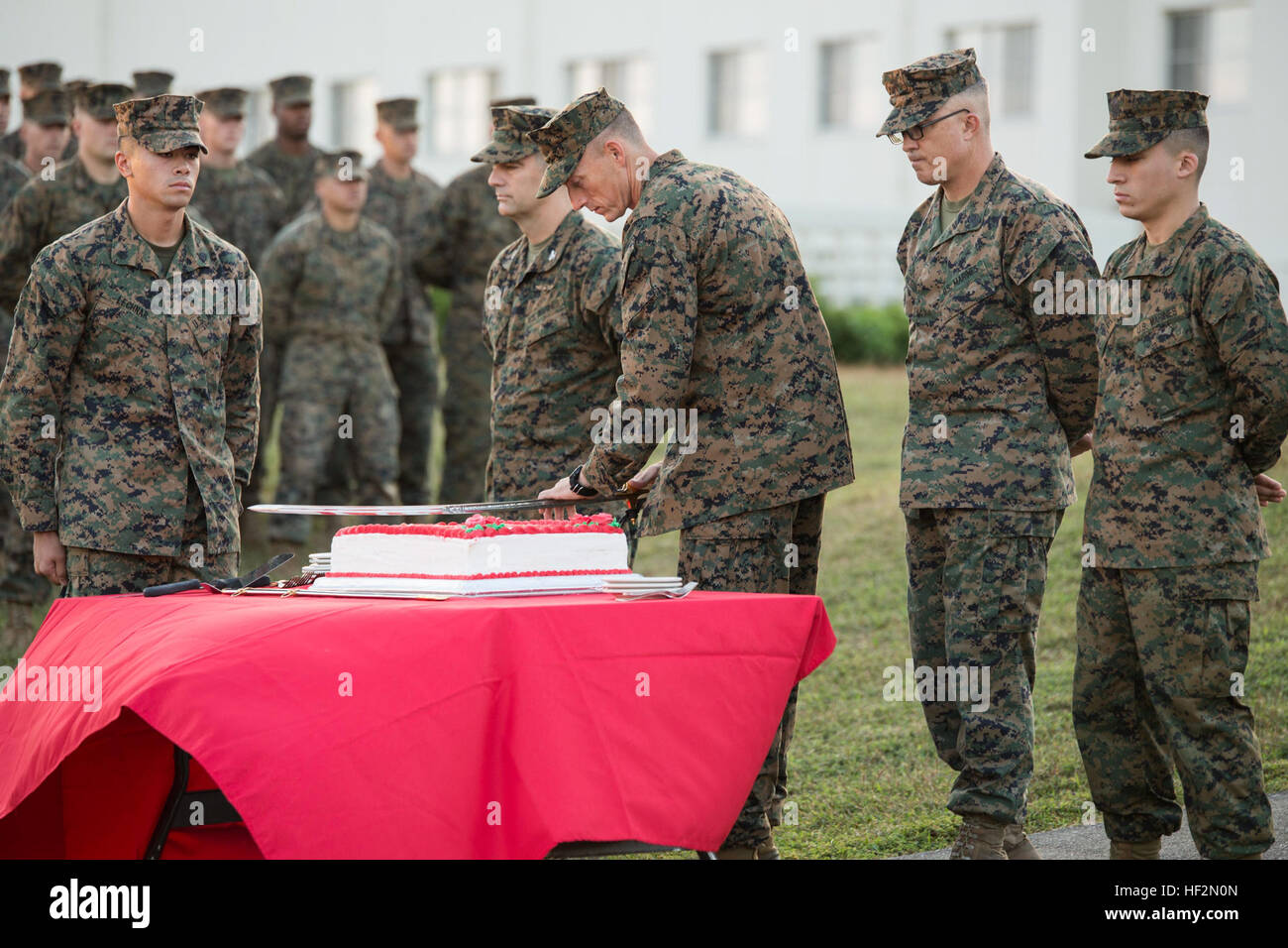 Lieutenant Colonel Robert C. Rice cuts the cake during a Marine Corps ...