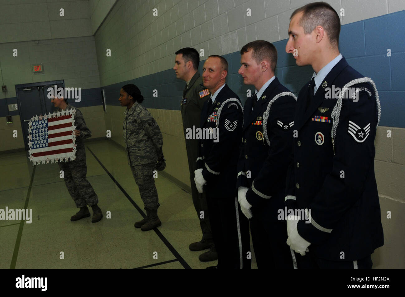 Tech. Sgt. Katie Casto holds a Veterans Day sign made by children of ...