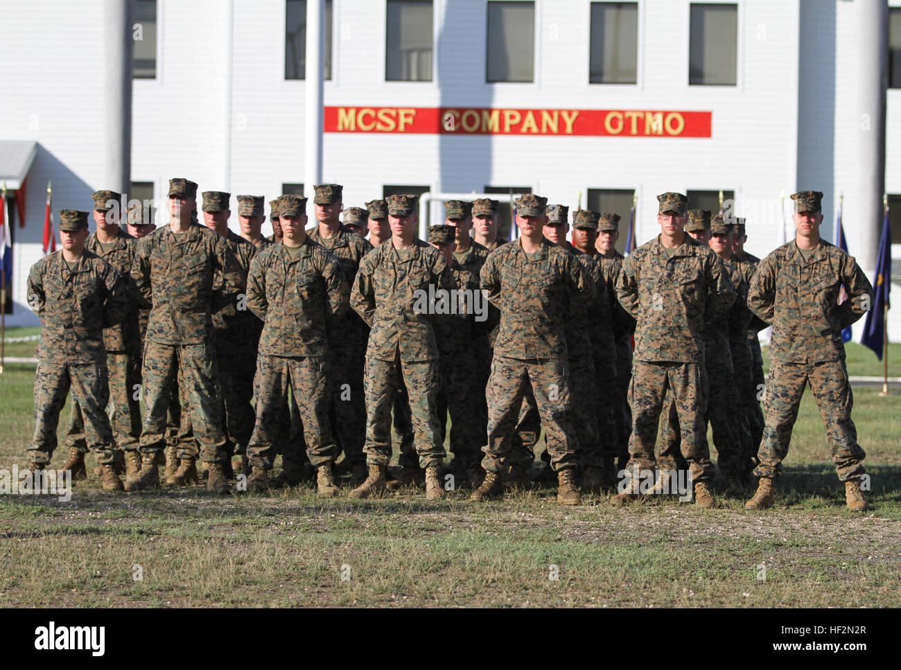 Marines stand at parade rest on Marine hill parade deck at U.S. Naval ...