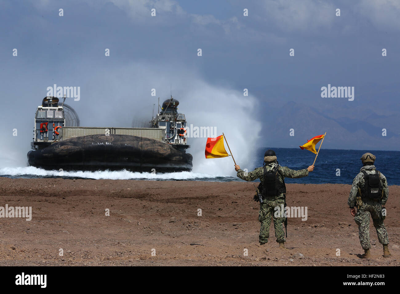 A U.S. Navy sailor with Assault Craft Unit 5, Beachmaster Unit One ...