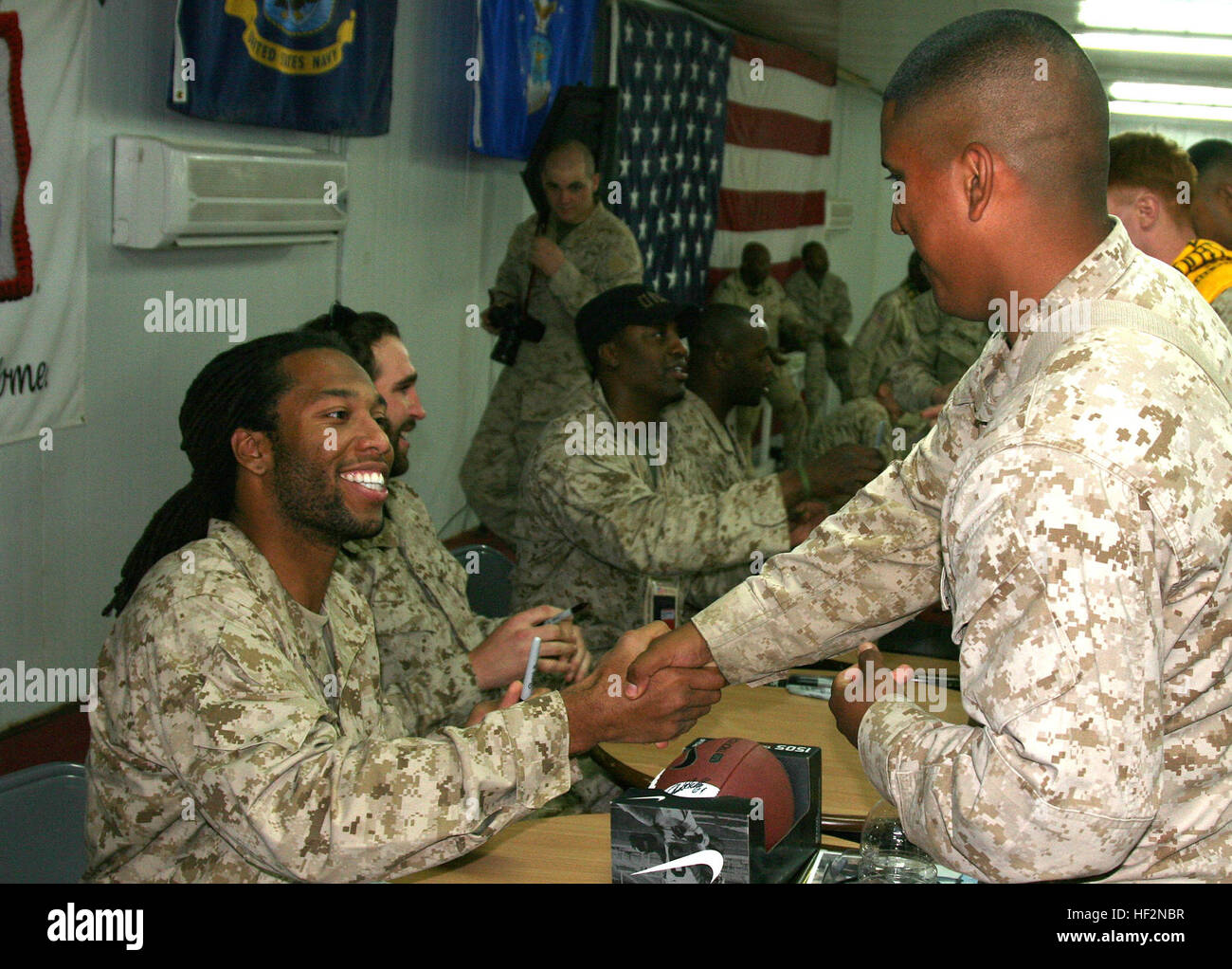 Arizona Cardinals wide receiver Larry Fitzgerald shakes hands with a ...