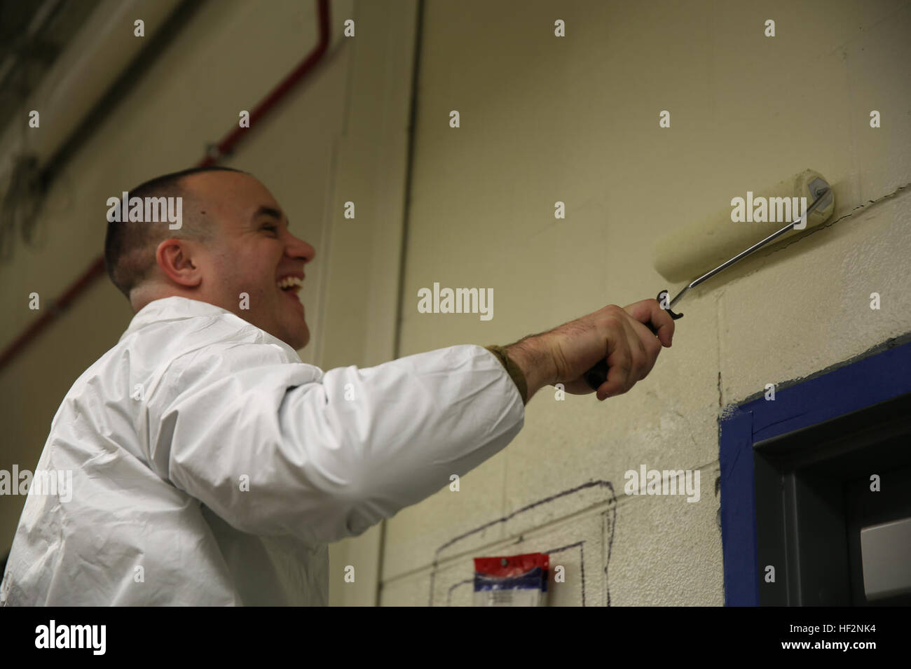 Cpl. Joseph Stabile paints a wall during renovations to the Marine ...
