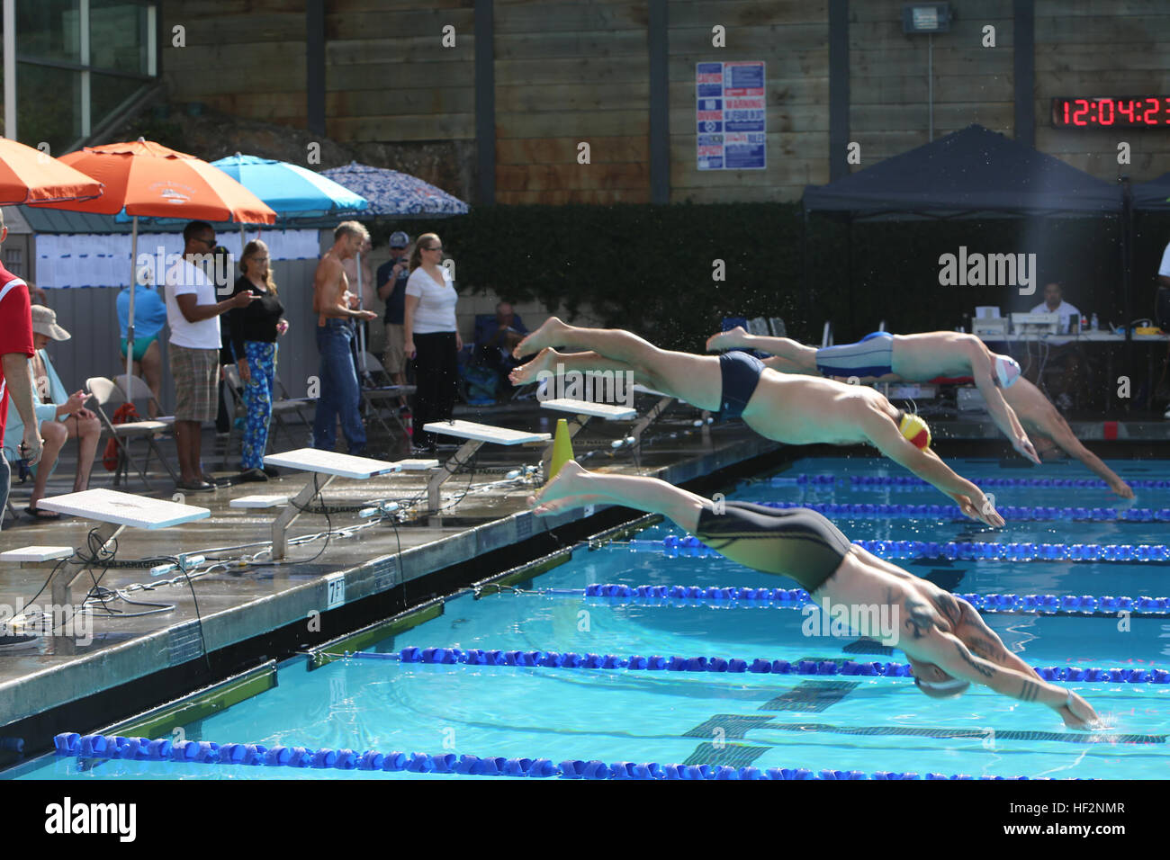 Petty Officer 1st Class Jamie Sclater, a hospital corpsman, swims in ...