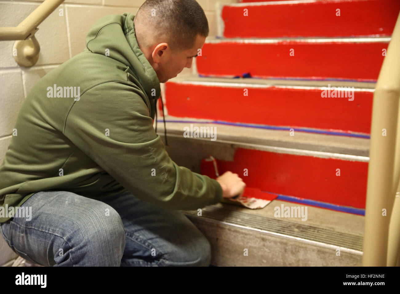 First Lt. Edwin Roman paints steps in barracks 4295 at Marine Corps Air ...