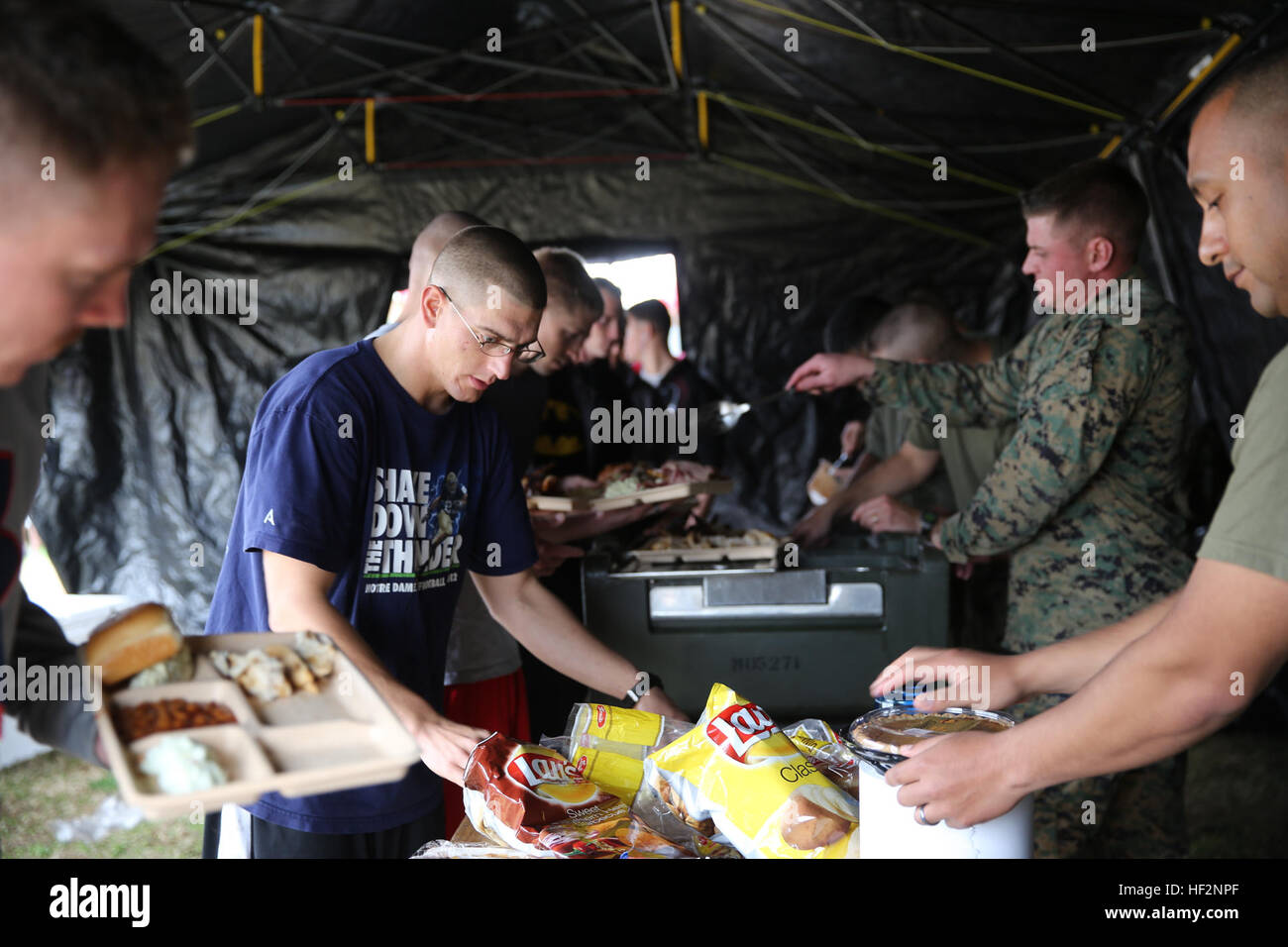 Marines with Marine Wing Support Squadron 271 serve food to single ...