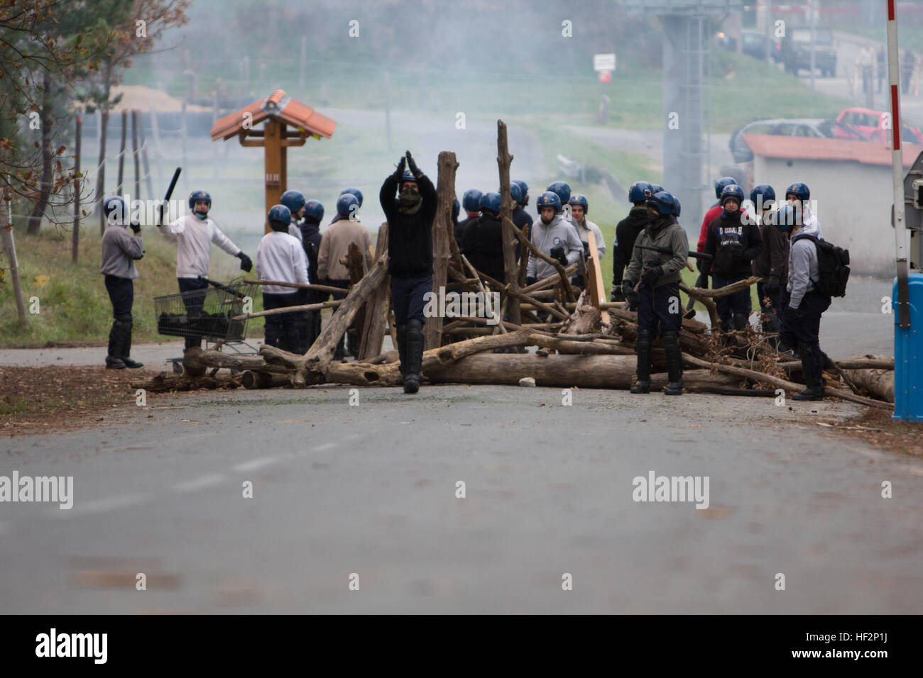 A road block is set up by role-playing rioters during crowd and riot ...