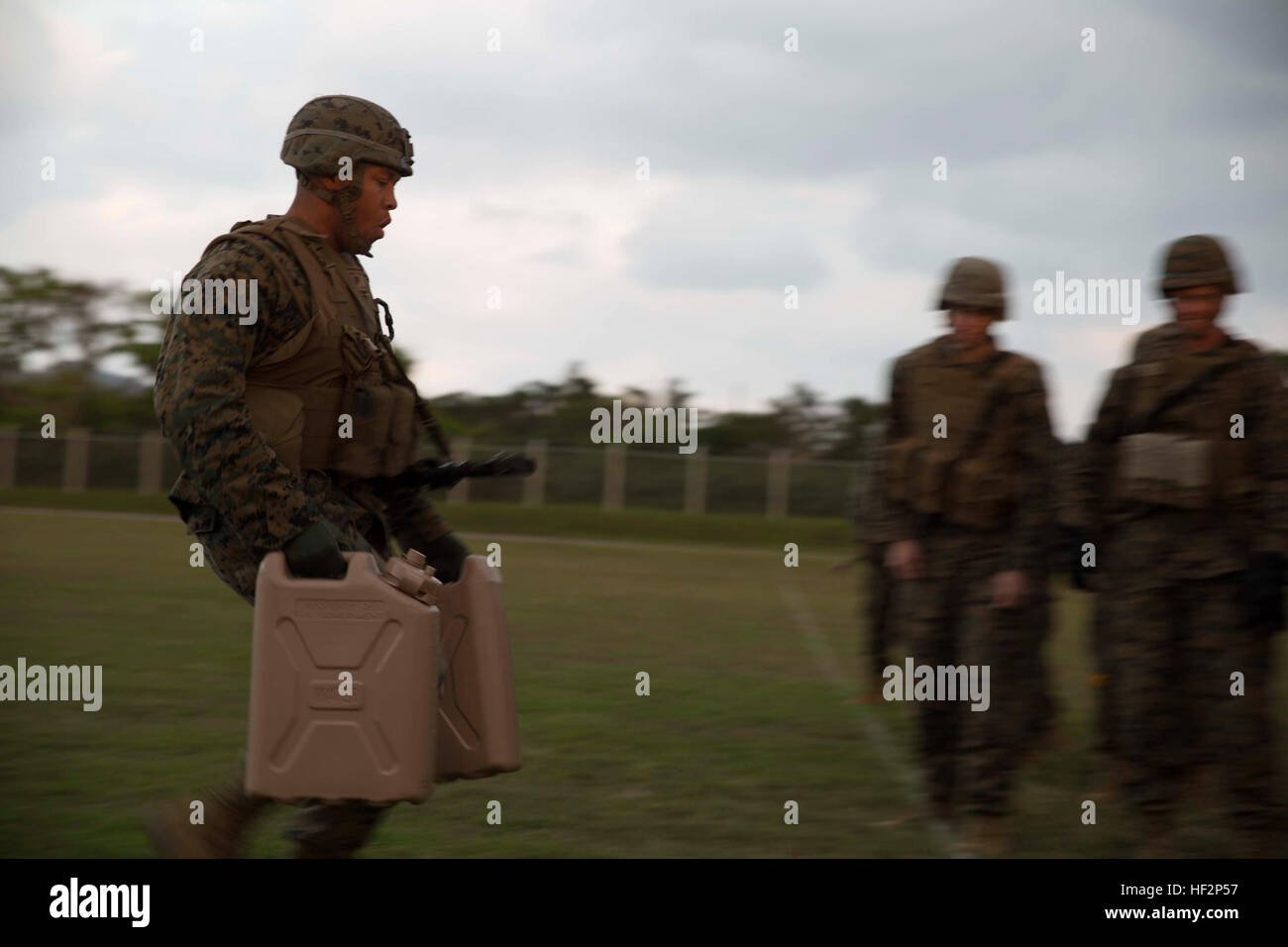 Cpl. Chad C. Lawrence crosses the finish line during a relay race Dec ...