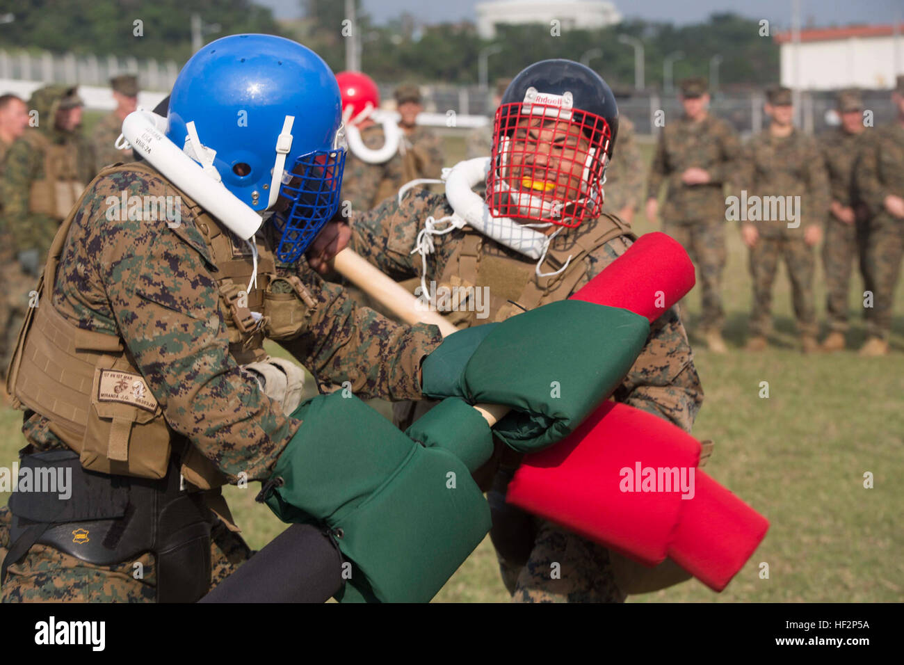 Marines battle each other with pugil sticks Dec. 5 at Camp Hansen during the first Caltrap ...