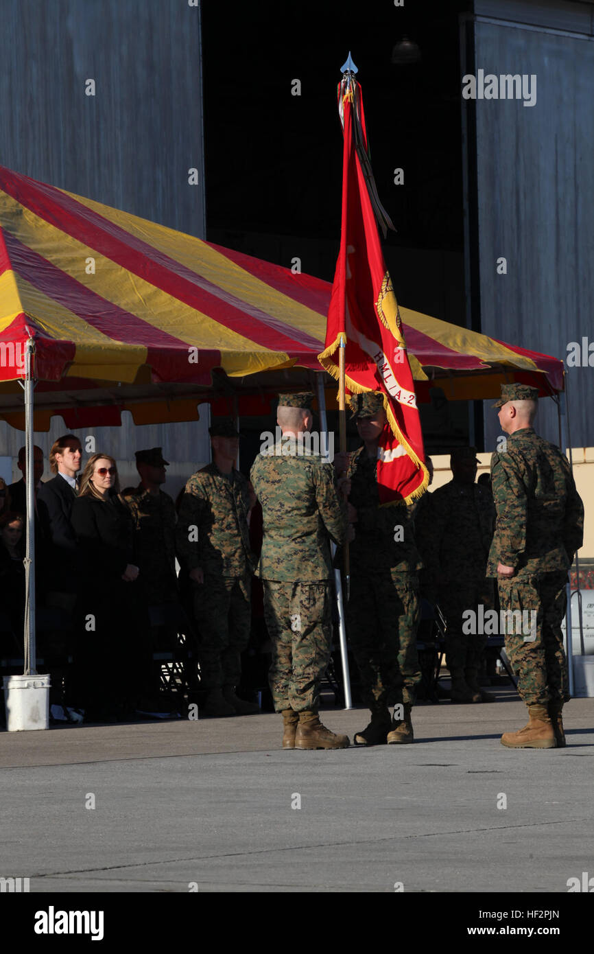 Lieutenant Col. William C. Hendricks, rear, accepts the unit flag from ...
