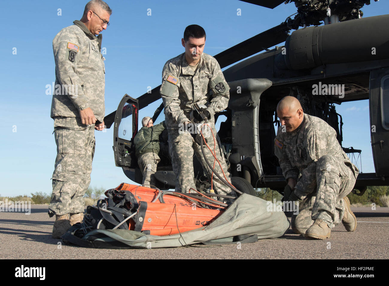 Army National Guard Staff Sgt. Louis Garcia, left, a UH-60 Black Hawk ...