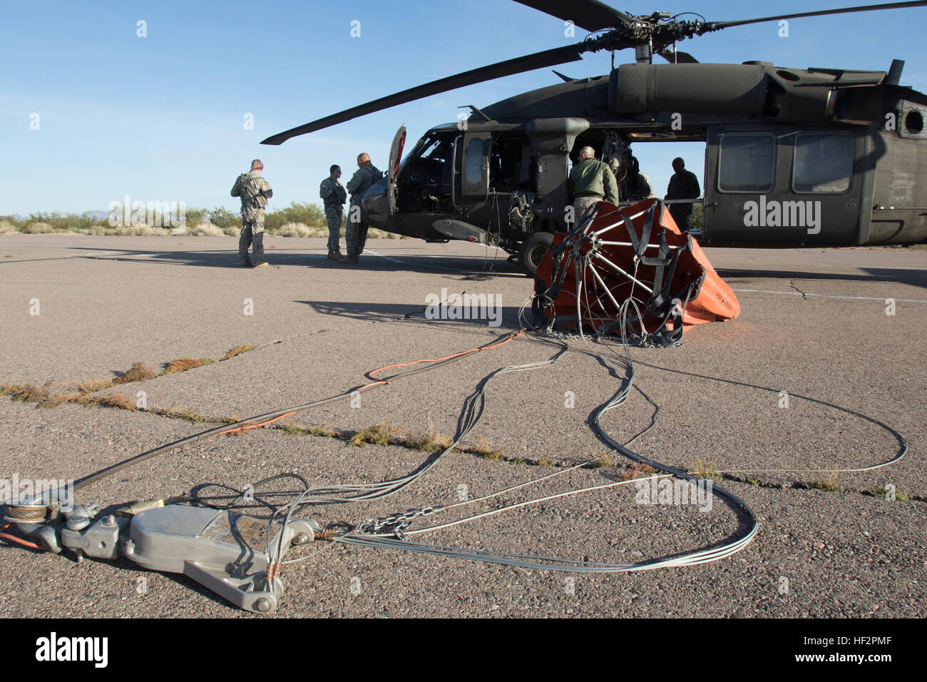 A Bambi Bucket used in aerial firefighting lays on a landing strip ...
