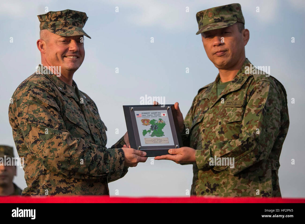 Japan Ground Self-Defense Force Col. Hiroji Yamashita, right, presents ...