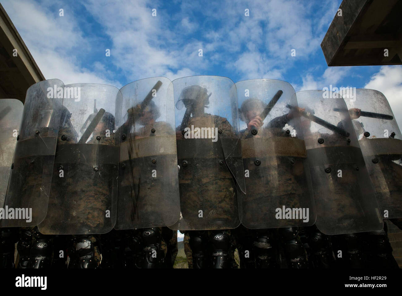 Marines stand in a crowd control formation Dec. 18 during nonlethal ...