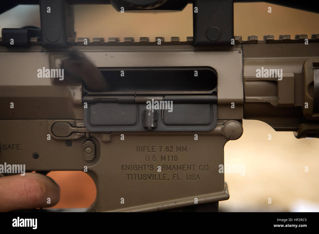 Casings of 7.62 mm ammunition are ejected from the chamber of an M110 ...