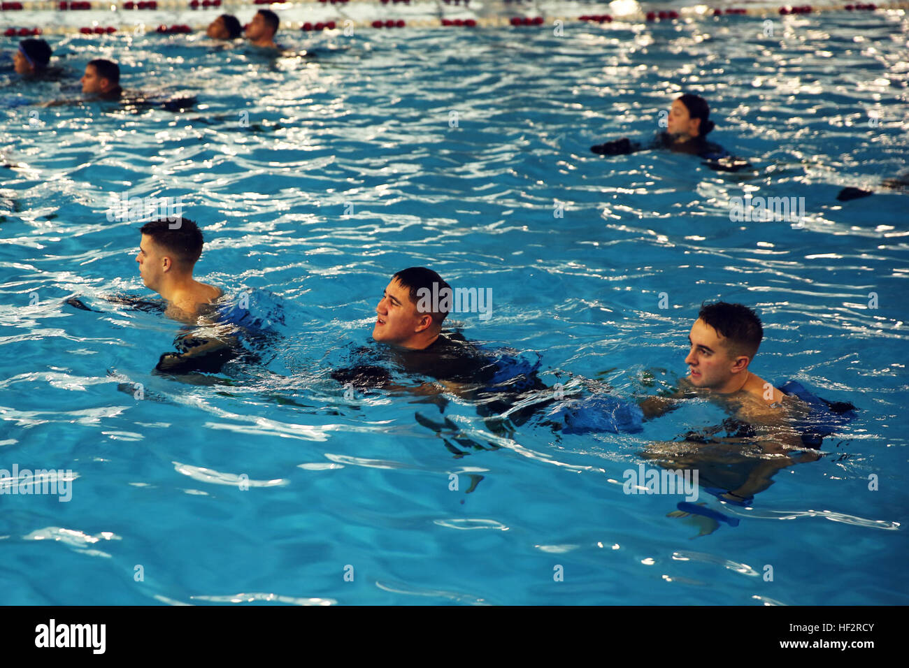 Marines with Marine Wing Communications Squadron 28 run in water during ...