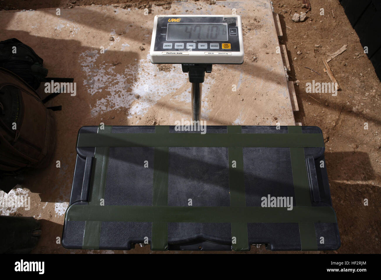 A box is weighed at the mobile post office at Forward Operating Base ...