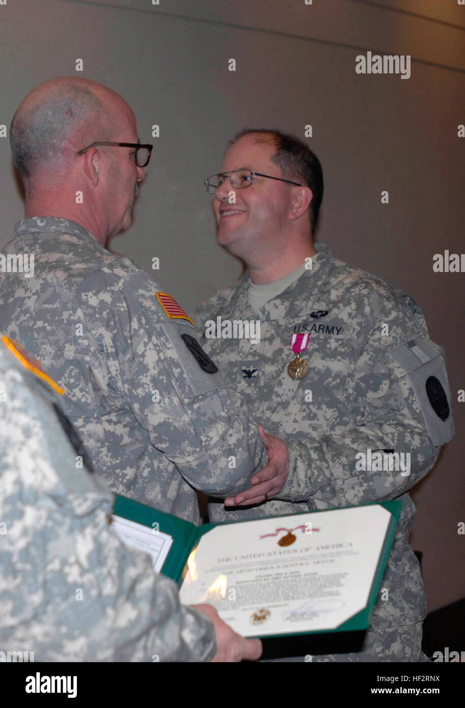 North Carolina Army National Guard Col. Eric Kohl (right), the outgoing ...