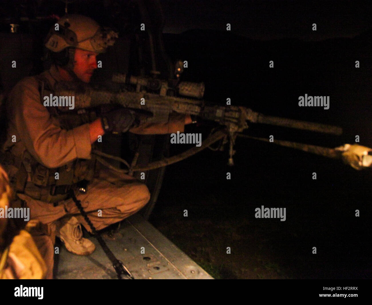 U.S Marine Sgt. Ian Walker prepares for takeoff before an aerial sniper ...