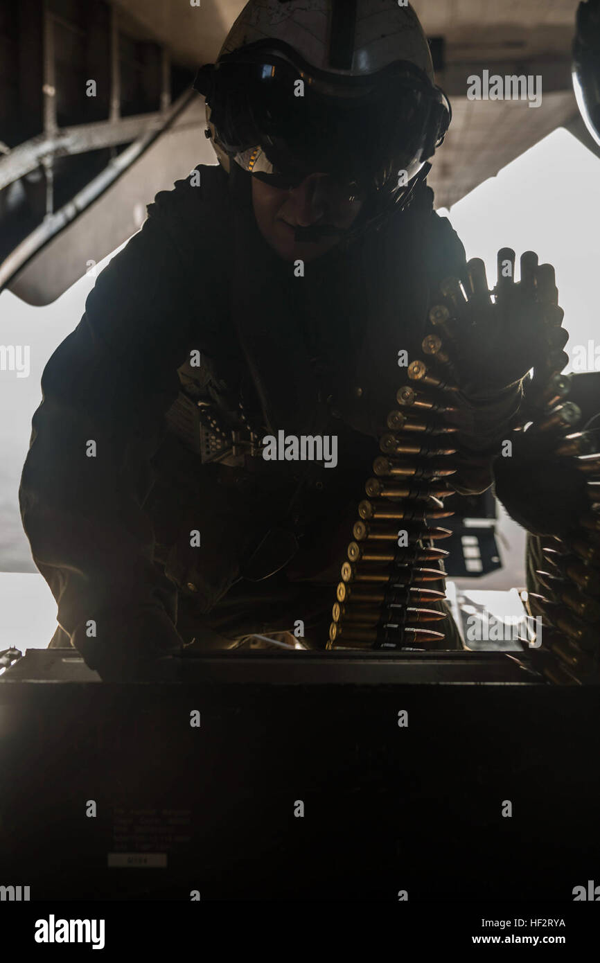 Sgt. Ryan Hetu, from Pittsfield, New Jersey, loads rounds into an ammo ...