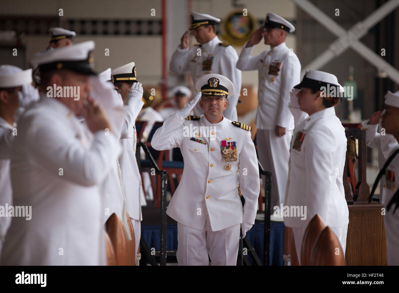 U.S. Navy Captain Lance Scott salutes fellow Sailors after relief of ...