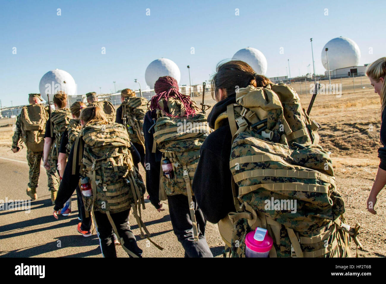 U.S. Marine Corps poolees endure a three-mile hike around Buckley with ...